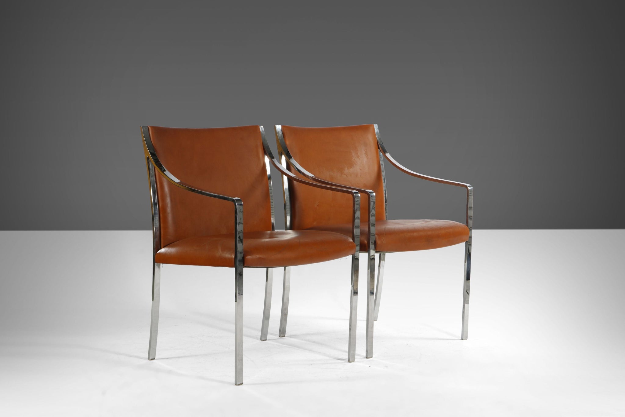 A Set of Two Chrome Accent Chairs in Original Naugahyde by Bert Englan